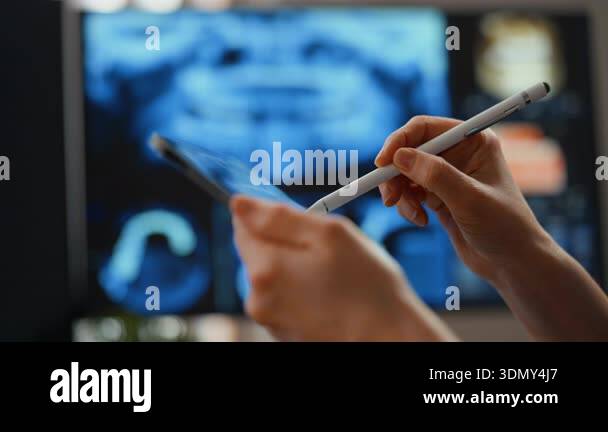 Close up view of Medical professional using tablet and stylus while ...