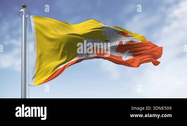 Bhutan national flag waving in the wind. Yellow upper triangle and an ...