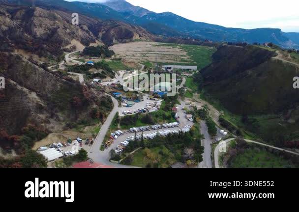 An industrial quarry or waste management facility with large buildings ...
