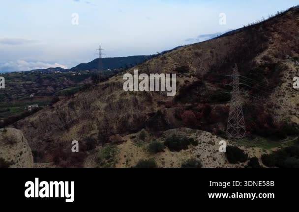 Wide panoramic view of burned vegetation, erosion scars, and two ...