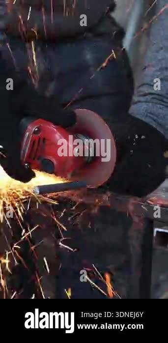 Working with an angle grinder in violation of safety rules. Cutting ...