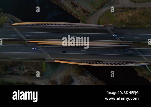 Aerial top-down view of a modern german autobahn bridge over a river ...