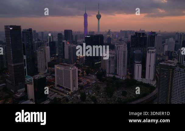 Kuala Lumpur city skyline during a beautiful sunset, featuring the ...