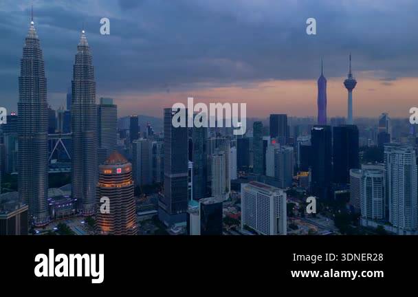 Kuala Lumpur city skyline featuring the iconic Petronas Twin Towers ...