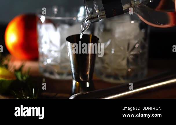 Delicious alcoholic cocktail made with gin tonic and ice in glasses for ...