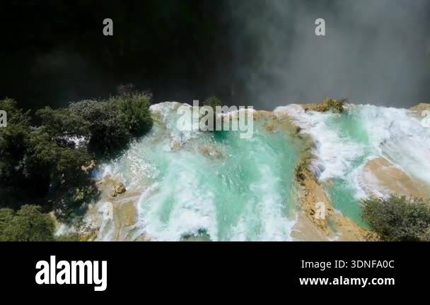 Cascada de Tamul shows powerful water dropping from a high cliff ...