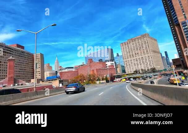 New York, USA, 25 August 2025: Highway curve with Manhattan buildings ...