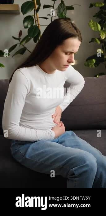 Sick woman in pain holding belly stomach feeling hurt abdomen ache ...