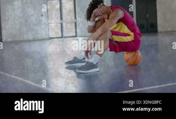 Circular overlay popping hoops player lifting head massaging calf with ...