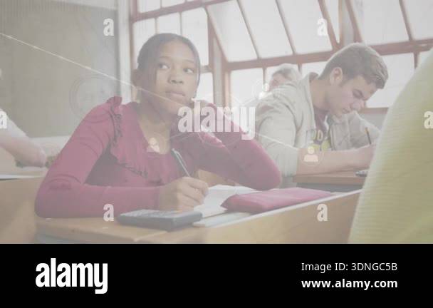 Teenage girl tapping pen on desk, activating icon network overlay ...