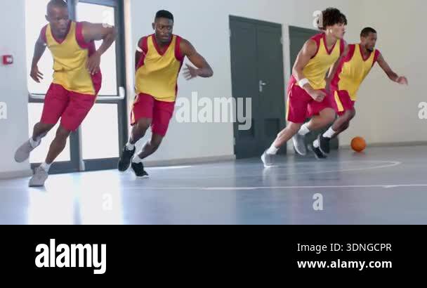 Basketball players receiving signal, sidestepping past balls for speed ...