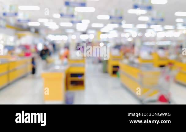 Busy shopping environment showing blurred of customers at cashier ...