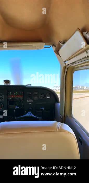 Pilot flying small airplane inside cockpit with clear sky view Stock ...