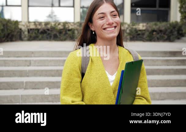 Blond university student girl joining group of friends in college ...