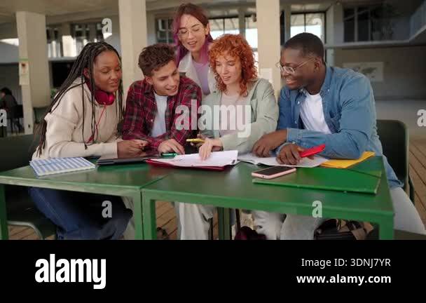 Group of international bachelor master degree students working together ...