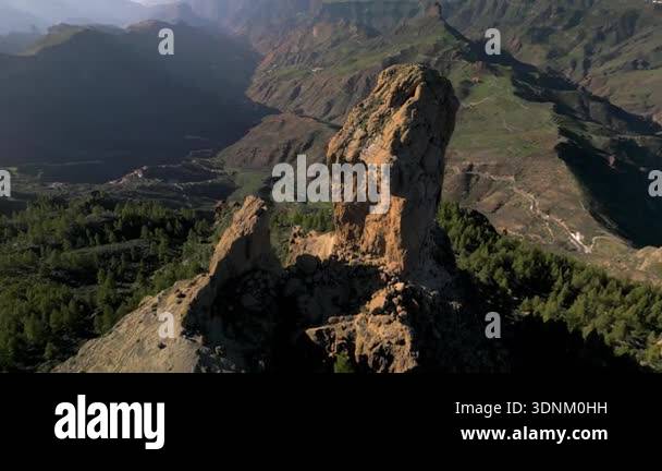 Aerial view of Roque Nublo a peak and monolith in Gran Canaria located ...