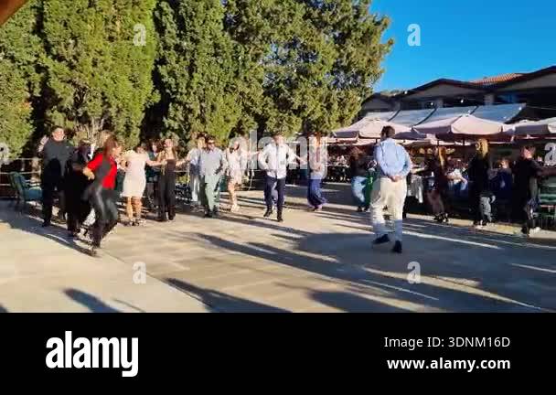 People dancing outdoors at festive gathering Stock Video Footage - Alamy
