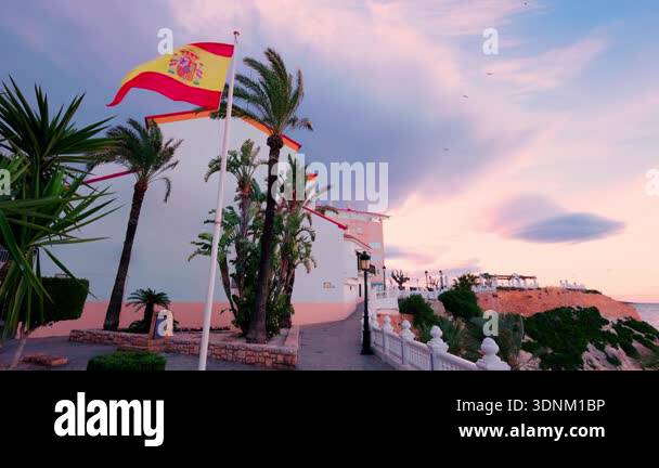 National flag of spain waving proudly in the wind against a beautiful ...