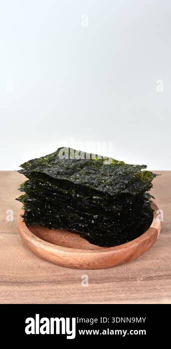 Roasted Korean Seaweed(Gim) Snack on Wooden Dish, Close Up Stock Video ...