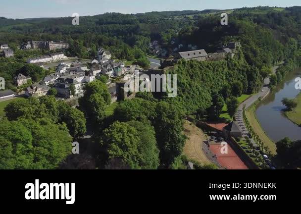 This video showcases a breathtaking aerial view of Bouillon, a charming ...