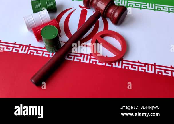 Metal barrels of oil, gas, or chemicals bearing the Iranian flag and a ...