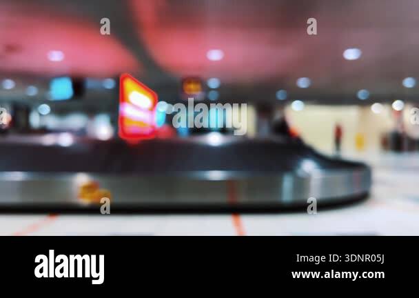 Blurred perspective of an airport baggage claim area, highlighting ...