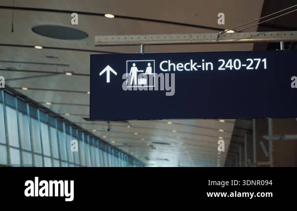 Airport sign shows check-in area 240-271 with symbols for passengers ...