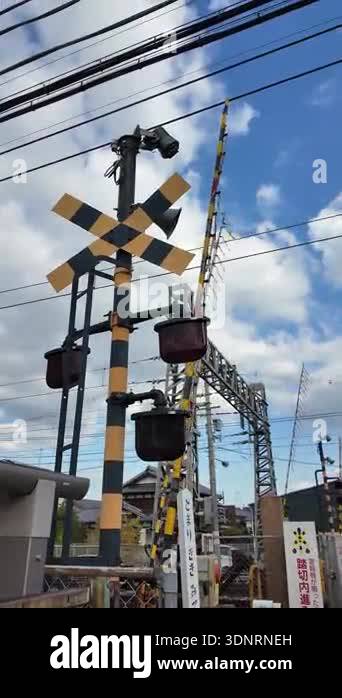 Japanese Railway Crossing with Warning Signals and Blue Sky. High ...