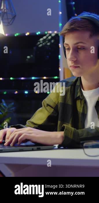 Handsome caucasian man working on laptop computer while sitting behind ...