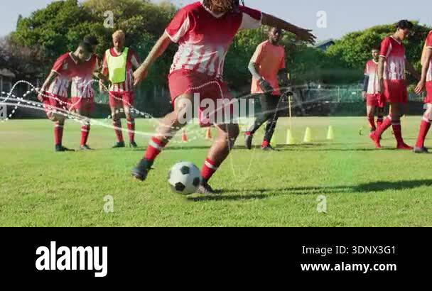 Soccer players lining up behind cones and poles, lead player stepping ...
