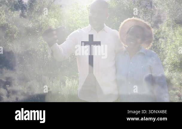 Senior man tilting phone capturing spiritual cloud overlay cross ...
