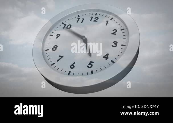 Analog clock floating over cloudy sky starting at nine then spinning ...