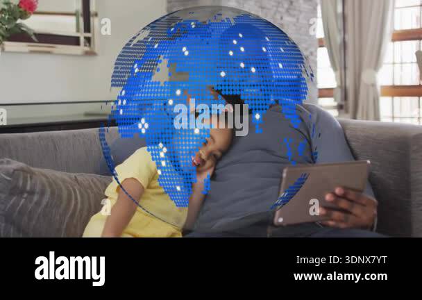 Father tapping tablet screen swiping to show daughter while transparent ...