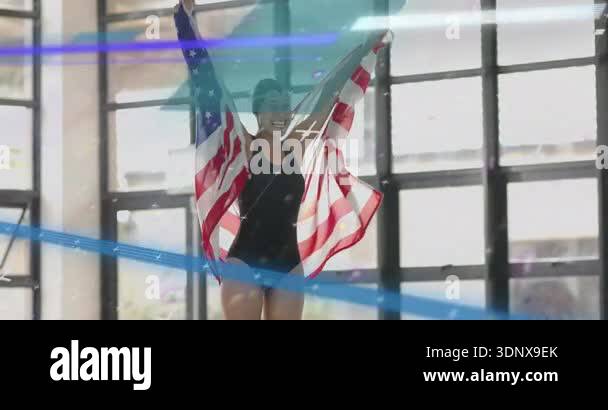 Swimmer exiting swim meet and wrapping American flag around shoulders ...