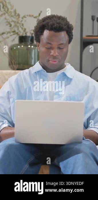 African Man Pointing at Camera with Laptop in Lap Stock Video Footage ...