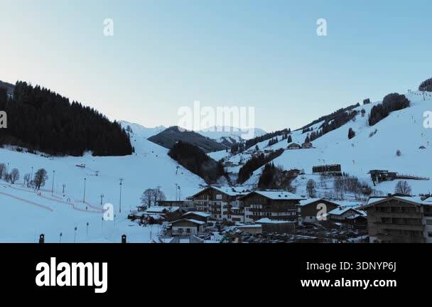 Austrian Alps landscape with Saalbach ski resort and snowy mountains in ...