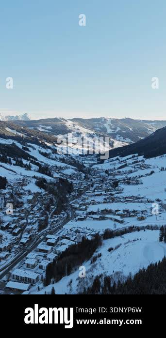 Static high altitude view over snowy Saalbach village and surrounding ...