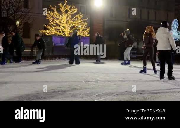 Krakow, Poland - November 30, 2025: People having fun during night ice ...