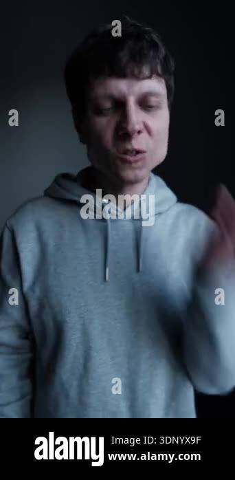 Angry man slapping his face in daylight room, self directed anger ...