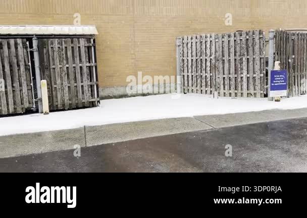 snowing on the store back parking lot in winter Stock Video Footage - Alamy