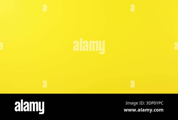 Close-up of a dialog bubble symbol on a bright yellow background ...