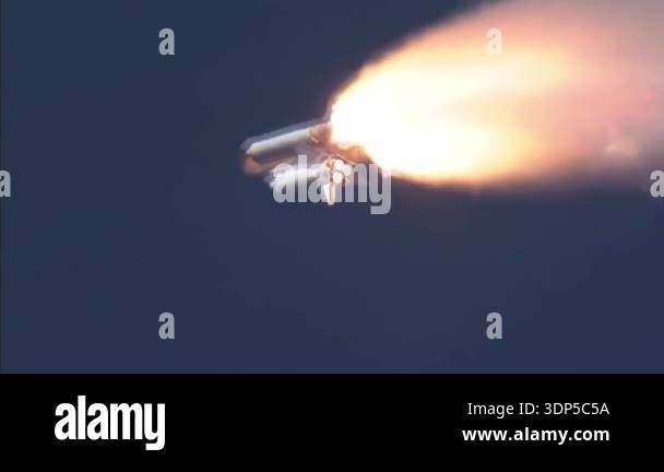 Space Shuttle solid rocket booster separation during launch in the dark ...