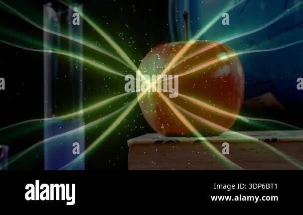 Green light emerging behind red apple and sending tendrils veiling ...