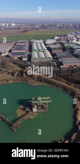 Aerial high-angle perspective of an abandoned sand and gravel quarry ...