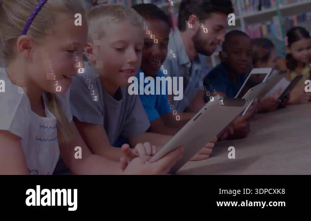 Children tapping and swiping tablets in library while teacher guiding ...