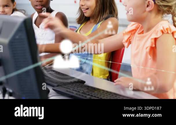 Three students typing and pointing in computer lab growing network ...