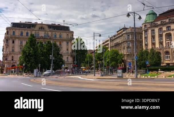 Budapest, Hungary - July 12, 2025: Tram and automobile traffic at Szent ...