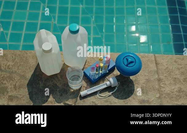 Top view of swimming pool maintenance equipment with liquid chemicals ...