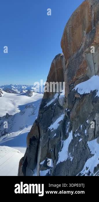 Cliffside Panorama with Sunset Light Over Snowy Alpine Peaks in Winter ...