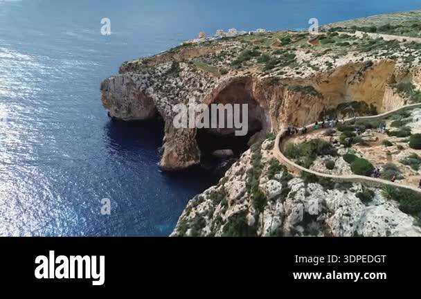 A stunning aerial view of the Blue Grotto sea arch in Malta Stock Video ...